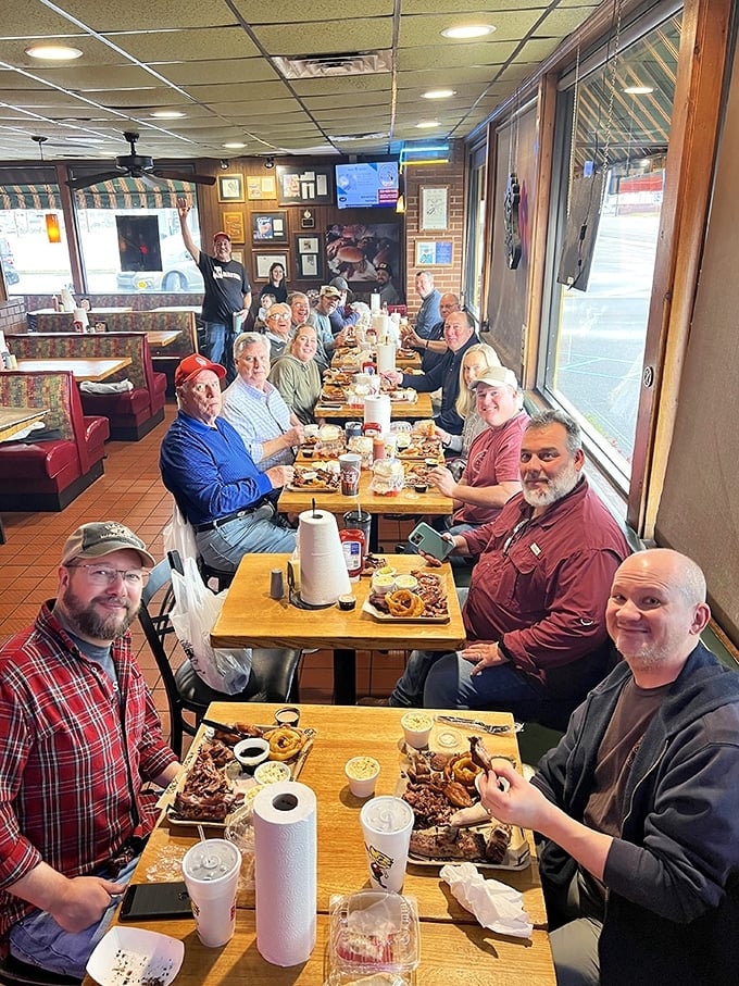 Not just a meal, but a gathering of the BBQ faithful. Those paper towel rolls aren't decorative—they're essential equipment.