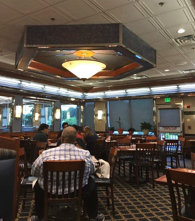 The dining room buzzes with conversation and clinking silverware—the soundtrack of community happening between bites of comfort food.