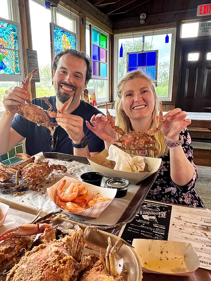 Happy diners showing off their crab haul like they've struck gold—and in Delaware seafood terms, they absolutely have.