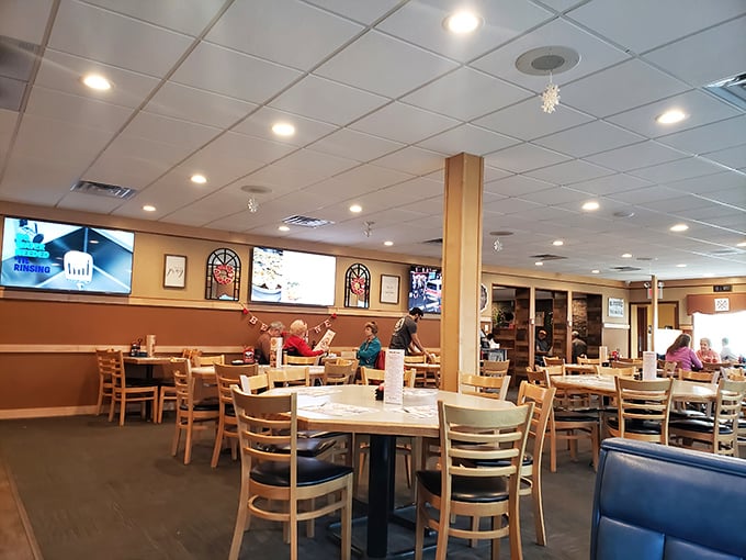 Tables filled with the universal language of satisfied diners – the quiet concentration of people eating well.