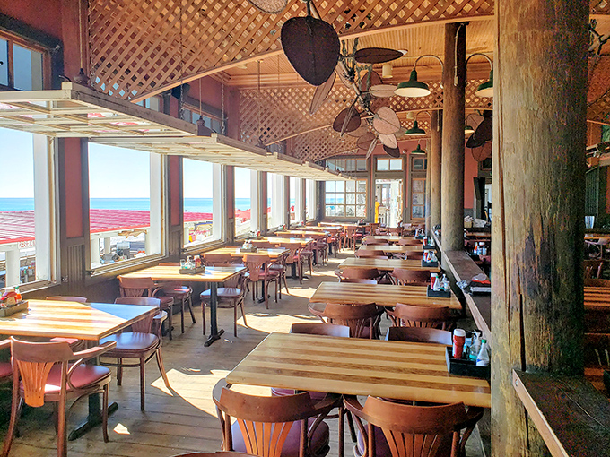Floor-to-ceiling windows ensure you never miss a wave while dining, turning every table into the best seat in the house.