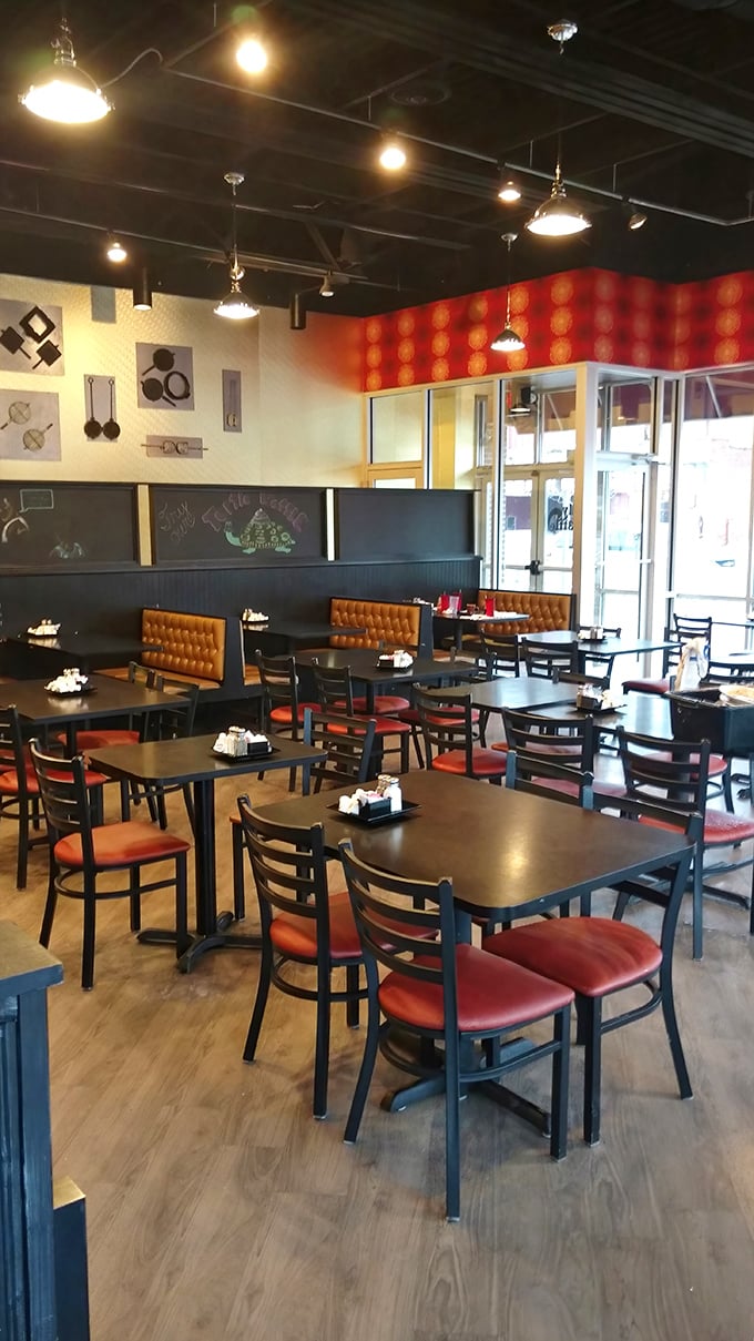 The dining area feels like it was designed by someone who actually eats in restaurants—comfortable, practical, and ready for serious eating.