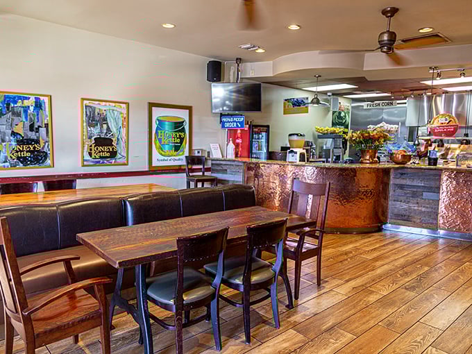 The dining area blends rustic charm with modern comfort, where framed Honey's Kettle artwork reminds you exactly why you came.