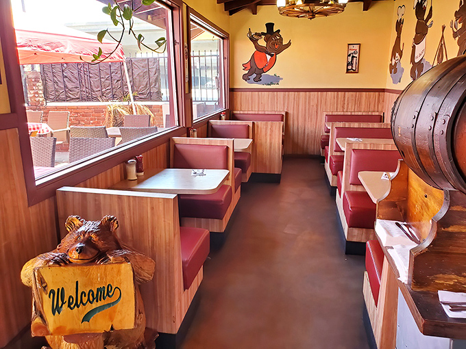 Wooden booths, burgundy vinyl, and that carved bear welcoming you in—this dining room hasn't changed in decades, and that's exactly how we like it.