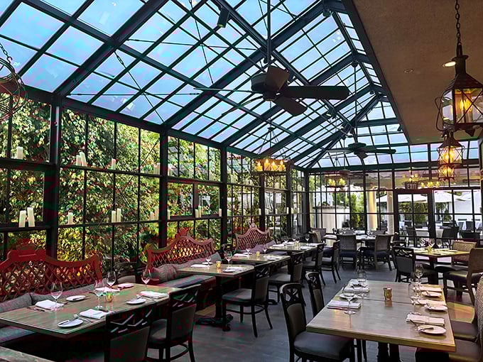 The greenhouse dining area brings the outside in, offering sunshine by day and starlight by night without sacrificing climate control.
