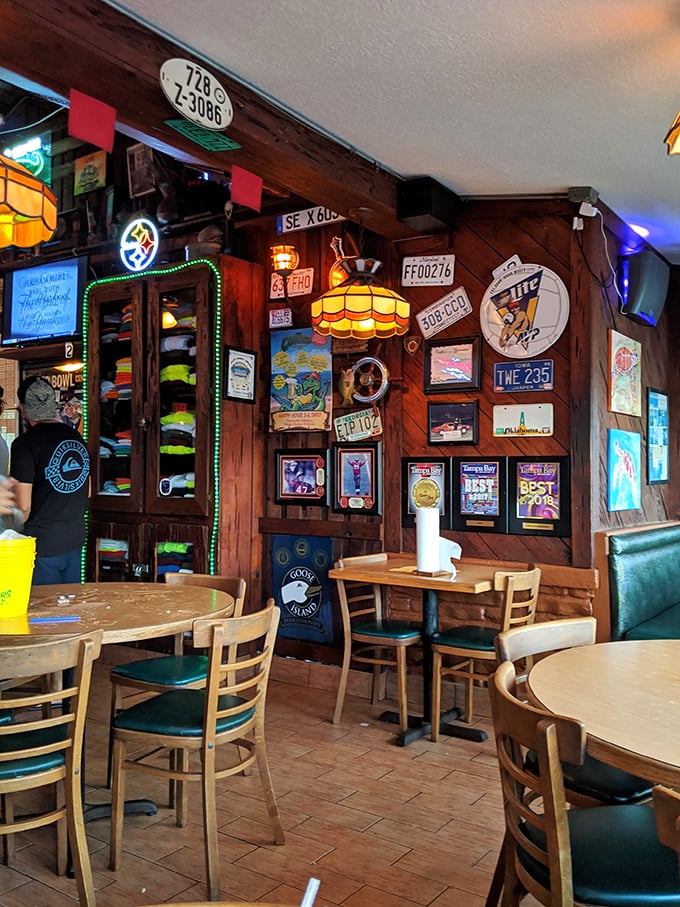 License plates, neon signs, and wooden charm—this isn't manufactured ambiance, it's decades of authentic beach bar evolution in its natural habitat.