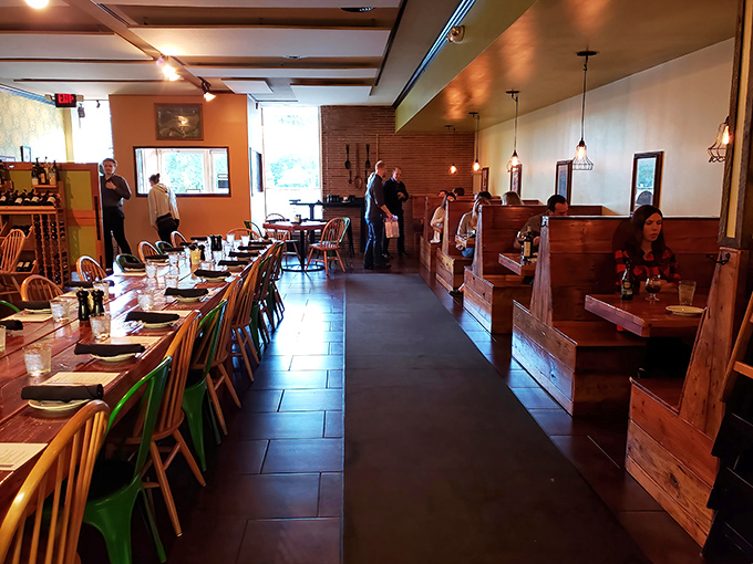 The dining area balances rustic charm with comfortable seating—exactly where you want to linger over that last bite of pasta.