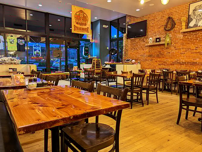 Evening light bathes the dining room in golden hues, turning wooden tables and exposed brick into something from a Norman Rockwell painting.