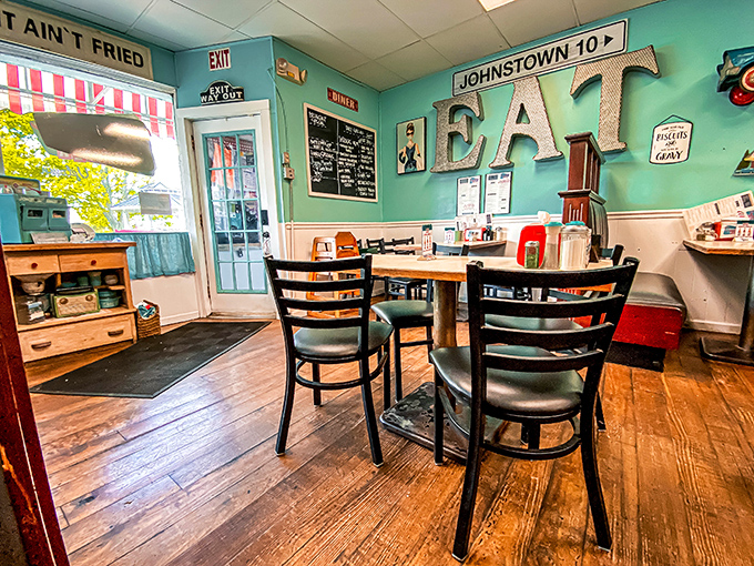 The "EAT" sign isn't just decoration—it's the simplest, most honest command you'll happily obey in this cozy corner of the diner.