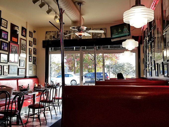 Red vinyl booths that have cradled Columbus conversations for decades—from first dates to family reunions, all under the glow of vintage lighting.