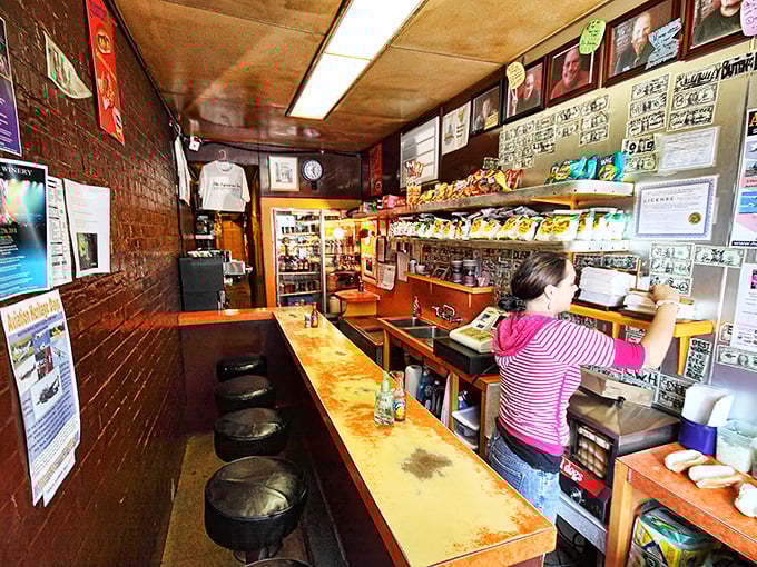 The narrow dining counter where strangers become friends over shared condiments and the universal language of "mmmmm."