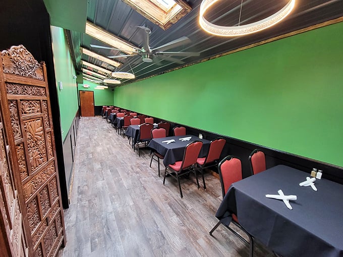 The dining room's vibrant green walls and intricately carved wooden doors create an unexpected oasis of calm in the heart of Ohio.