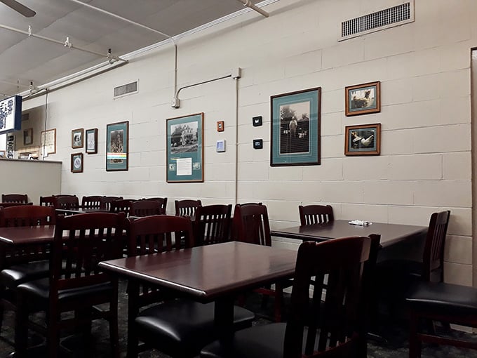 White walls, wooden tables, and framed memories create the perfect canvas for food that needs no fancy backdrop—just your undivided attention.