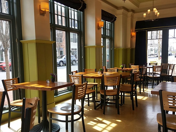 Sunlight streams through tall windows, turning an ordinary lunch into a moment worthy of an Impressionist painting.