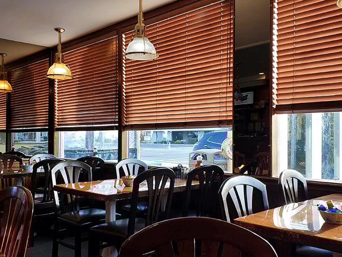 Morning light filters through wooden blinds, creating that perfect "let's linger over coffee and conversation" atmosphere.