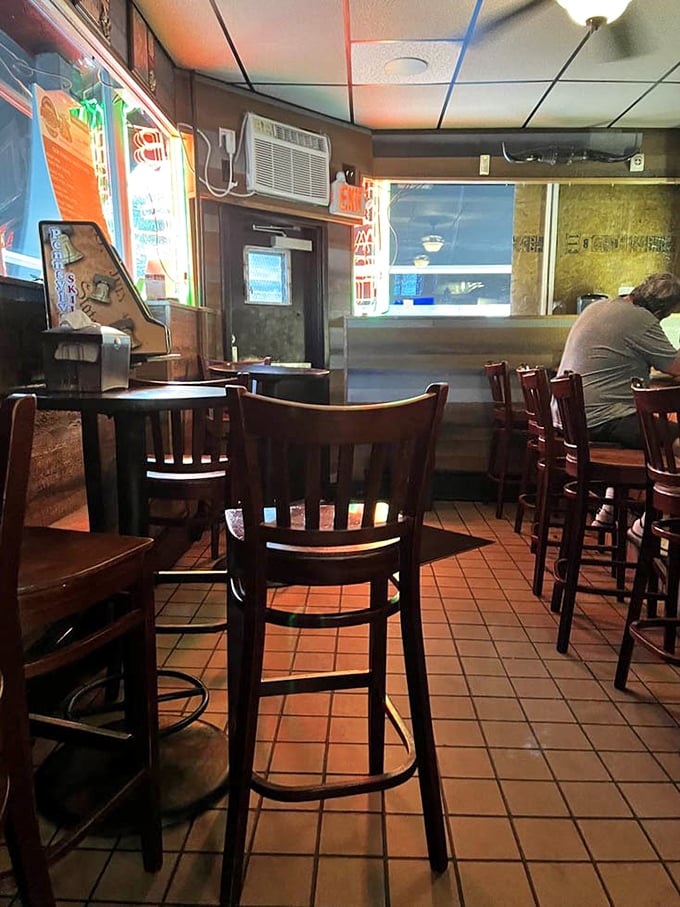 The dining area speaks volumes about Nick's priorities—comfortable simplicity that puts the spotlight where it belongs: on the food.
