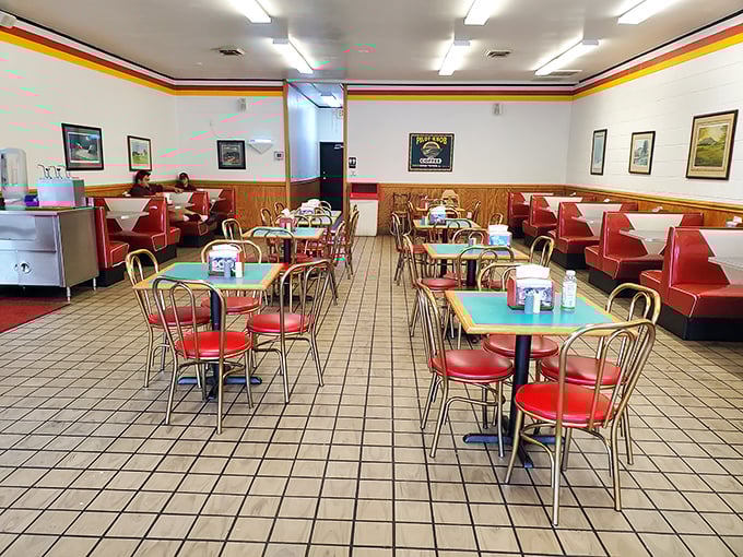 The dining room hasn't changed in decades because perfection doesn't need updating – just those green tables and red booths telling stories.