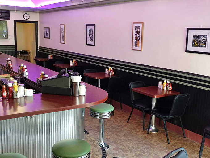 The dining area balances comfort with efficiency—where conversations flow as freely as the coffee. Those booths have heard decades of morning stories.