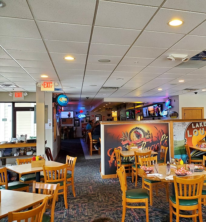 The dining area strikes that perfect balance—spacious enough for comfort, cozy enough for conversation, with TVs positioned for optimal game-watching angles.