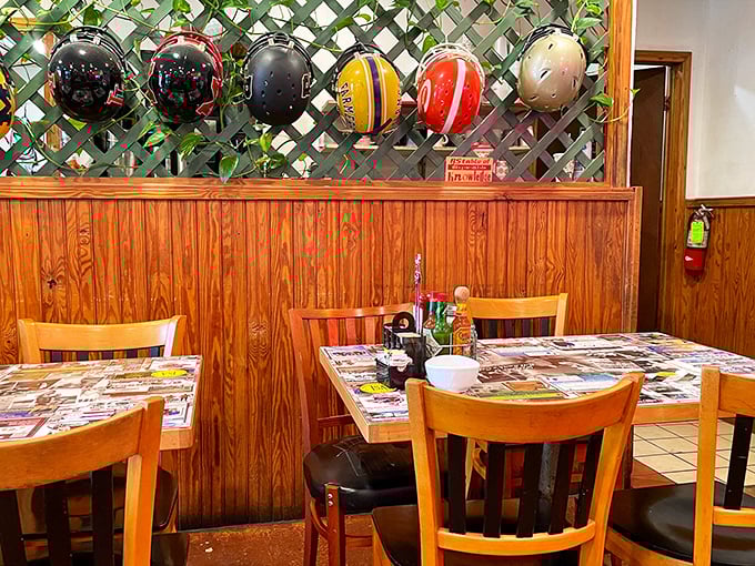 Football helmets watching over diners like patron saints of Texas culture—this dining area tells stories even when nobody's talking.