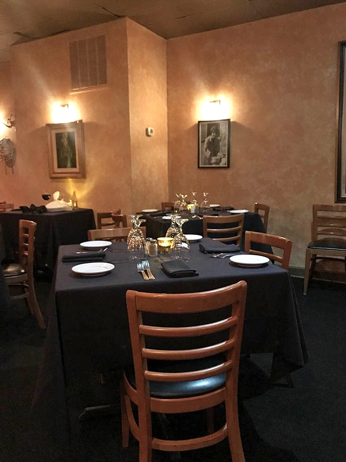 Tables dressed in crisp linens and soft lighting create dining spaces that feel both special occasion-worthy and Tuesday night comfortable.