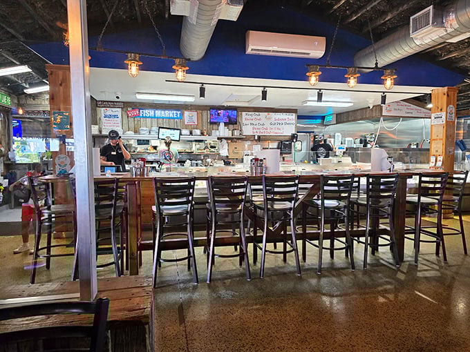 The fish market counter offers front-row seats to culinary transparency. Watch your dinner being prepped while sipping something cold.