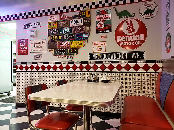 Vintage license plates and classic automotive signs create the perfect backdrop for conversations that flow as easily as the bottomless coffee.