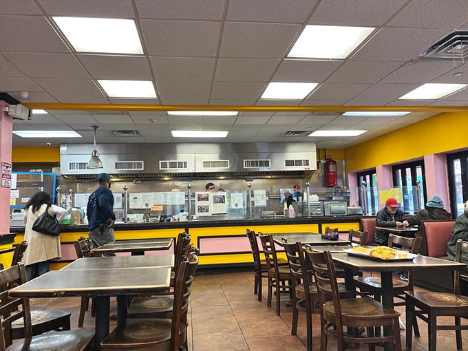 The dining area isn't winning design awards, but that yellow trim frames something more important: food worth sitting down for.