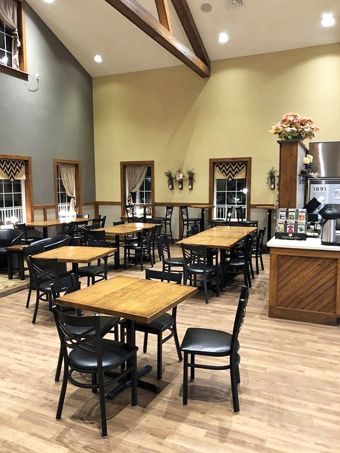 Vaulted ceilings and wooden beams create a dining space that feels both rustic and refined – like a barn that went to finishing school.