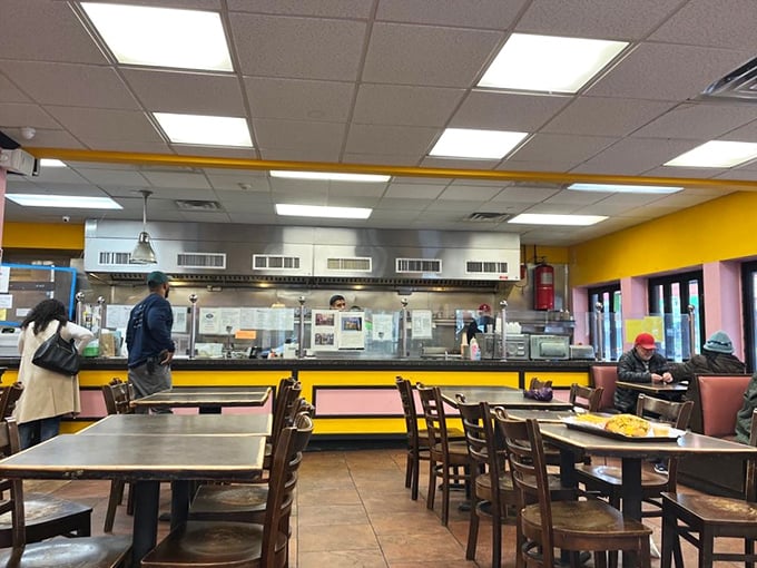 The counter setup lets you witness sandwich sorcery while your stomach provides the soundtrack.