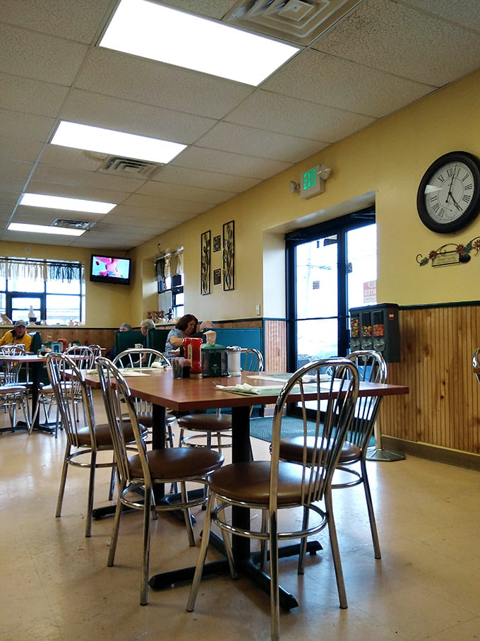 Simple tables, comfortable chairs, and yellow walls – the dining area has everything you need and nothing you don't.
