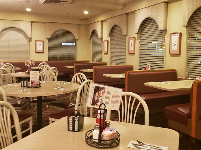 The dining area waits patiently between rushes, like a theater between performances – each booth ready to host the next culinary experience.