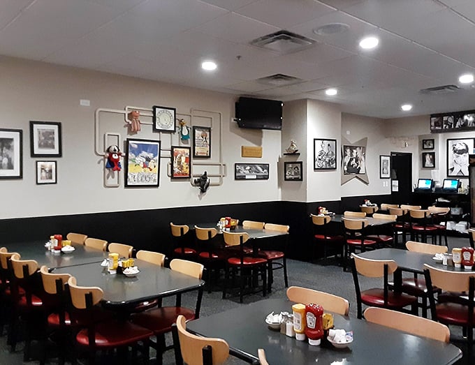 The dining area tells stories through its walls of memorabilia, while tables stand ready for the next chapter of breakfast memories.