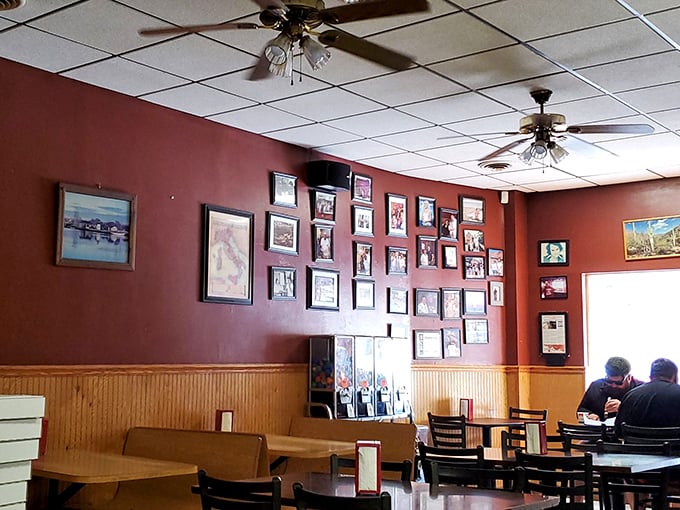 The dining room wall gallery—a visual history of Pittsburgh and proud pizza moments. Every frame tells a story; every booth holds memories.
