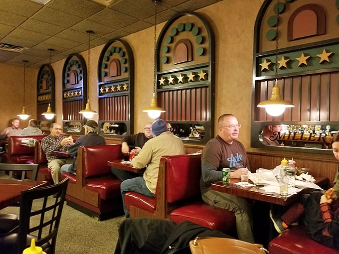 Red booths, wood tables, and decades of burger-fueled conversations – a dining room that feels like coming home, even on your first visit.