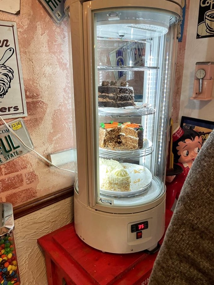 That dessert case stands like a sweet sentry, guarding treasures that would make your dentist weep with concern.