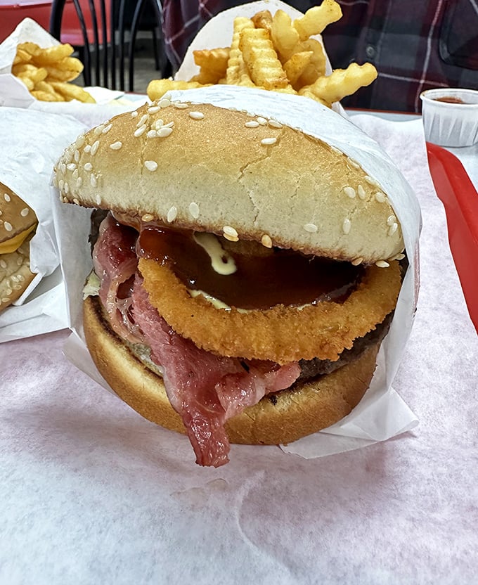 Not all heroes wear capes, but this Double Texas Burger definitely deserves one—a towering achievement of beef, bacon, and pure American ingenuity.