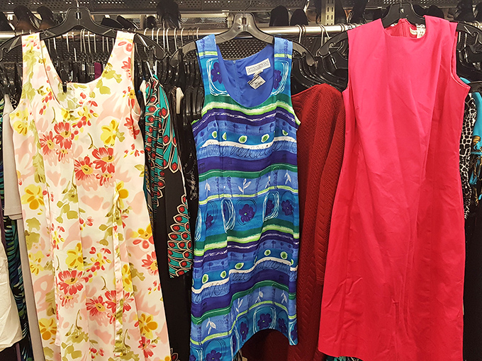 Summer dresses in a spectrum of patterns—floral, geometric, and bold solid colors—await their next garden party or beach outing.