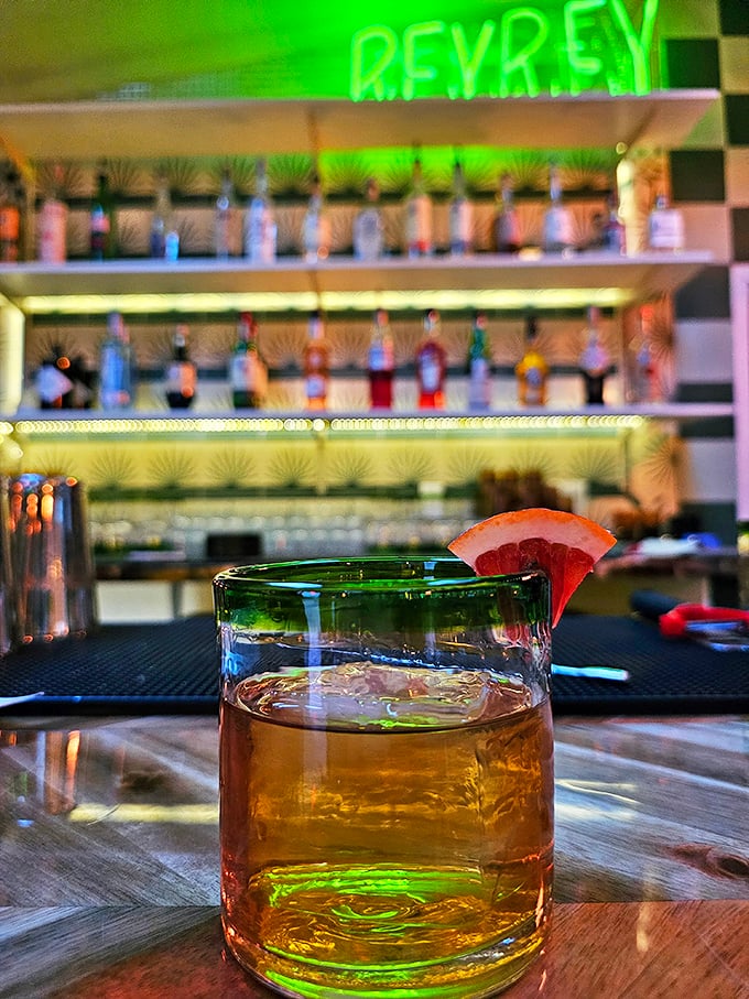 The bar at Rey Rey offers liquid companionship to your taco feast—because sometimes great food deserves a proper toast.
