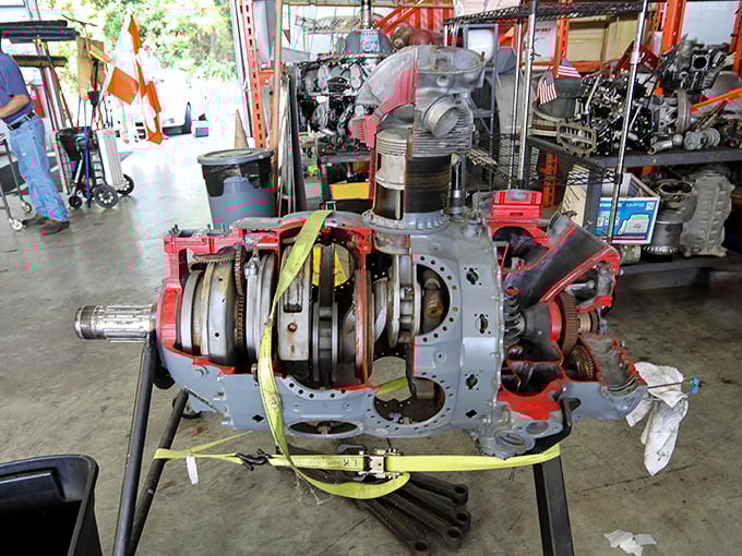 This partially disassembled radial engine reveals the intricate mechanical symphony that powered aircraft through the skies decades before digital technology.
