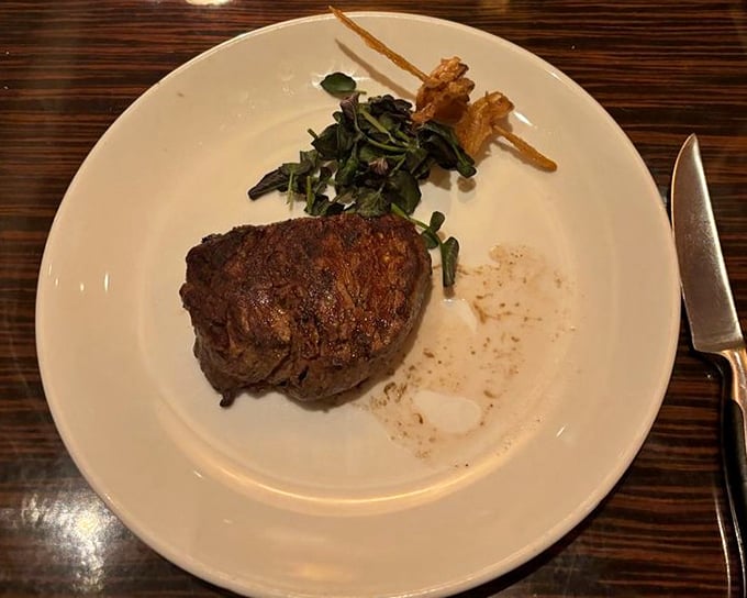 This filet mignon isn't just cooked—it's been treated with the respect a fine cut deserves. The kind of steak that makes conversation pause mid-sentence.