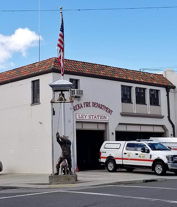 The Yreka Fire Department stands ready with a side of history. That firefighter statue isn't just decoration—it's a bronze thank-you to local heroes.