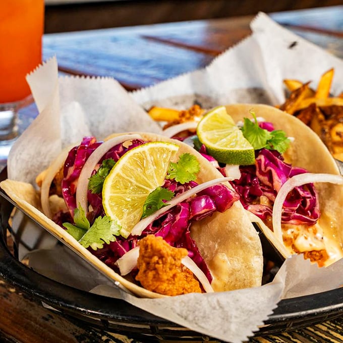 Fish tacos dressed with vibrant slaw and lime—a colorful celebration that brings the beach to your taste buds.
