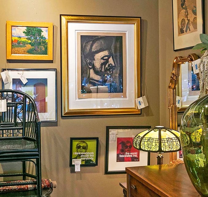The art wall creates a salon-style gallery where portraits of strangers might become the most interesting guests at your next dinner party.