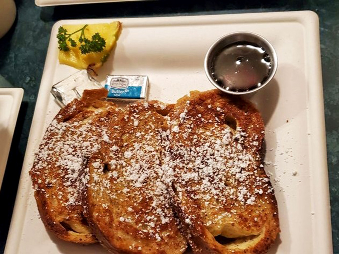 French toast that makes you question every other French toast you've ever eaten. Thick-cut, golden-brown, and dusted with powdered sugar perfection.
