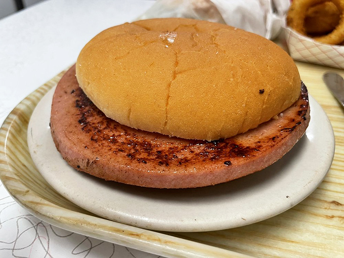 The fried bologna sandwich—childhood nostalgia upgraded for adult appetites. This thick-cut masterpiece makes no apologies for its simple perfection.