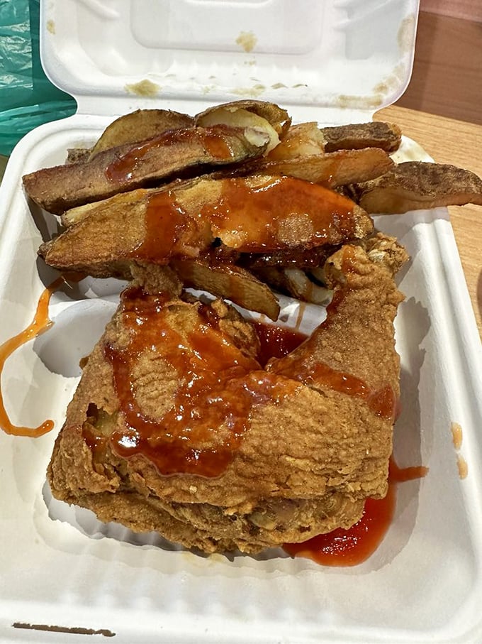 When chicken meets hot sauce and potato wedges, it's not just a meal—it's a declaration that some combinations are simply meant to be.