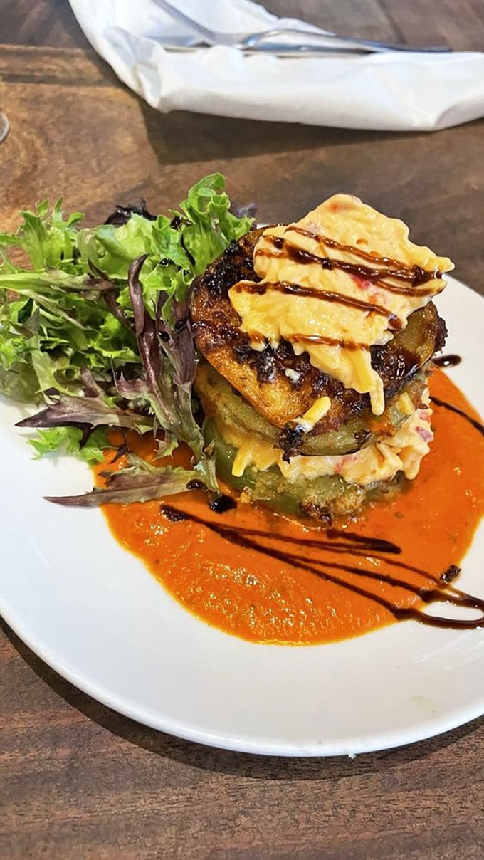 Stacked like a savory Southern layer cake, this fried green tomato creation proves vegetables can be the main event.
