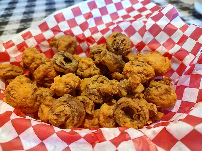 These golden-fried mushrooms aren't just appetizers—they're little flavor bombs that disappear from the basket faster than you can say "one more, please."