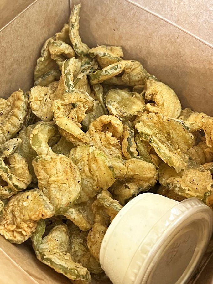 Fried pickles: the unsung heroes of appetizers. Crispy, tangy bites of joy served with a dipping sauce worth fighting over.